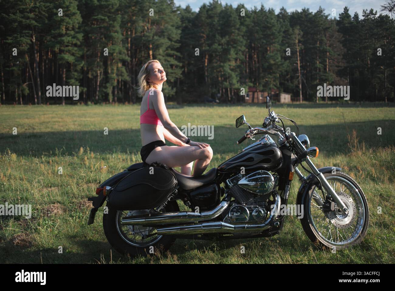 Woman in Bikini Sitting on a Chopper Motorcycle in Summer Stock Photo ...