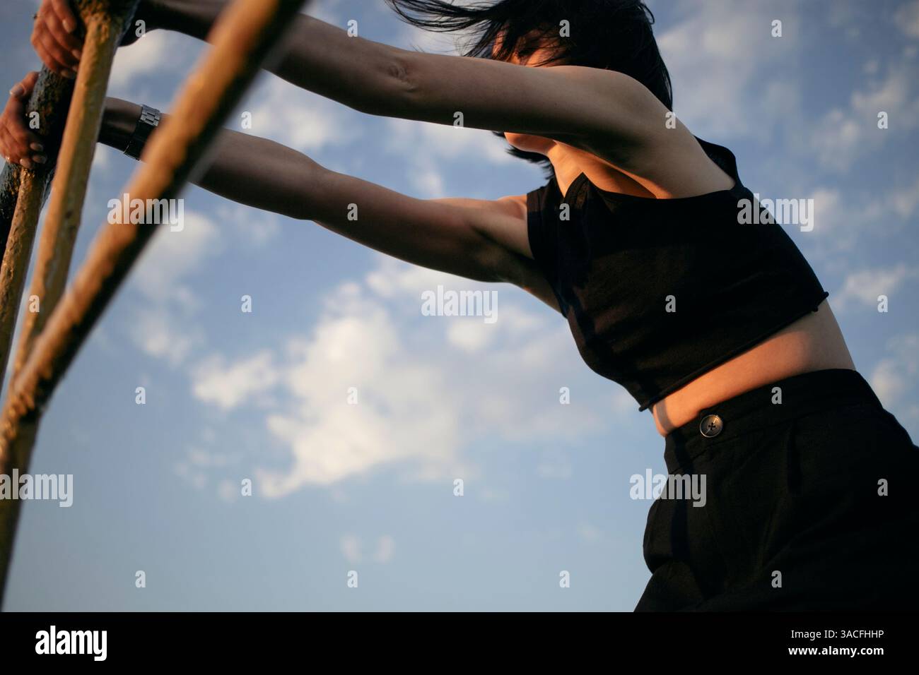 Dynamic Low-Angle Portrait of a Woman in Motion Stock Photo - Alamy