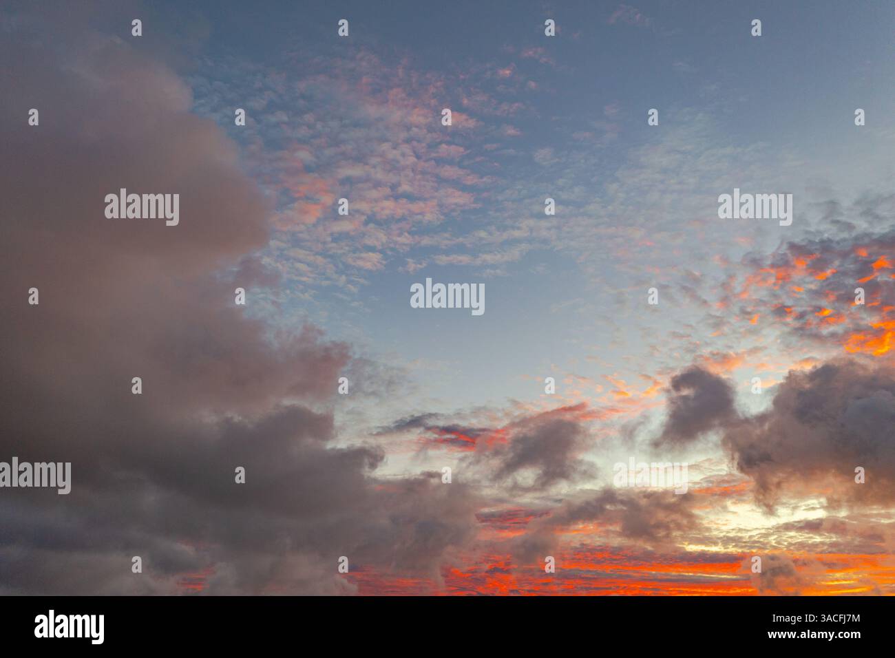 Aerial view clouds are moving slowly in the yellow sky at sunset. amazing cloud in yellow sky in ...
