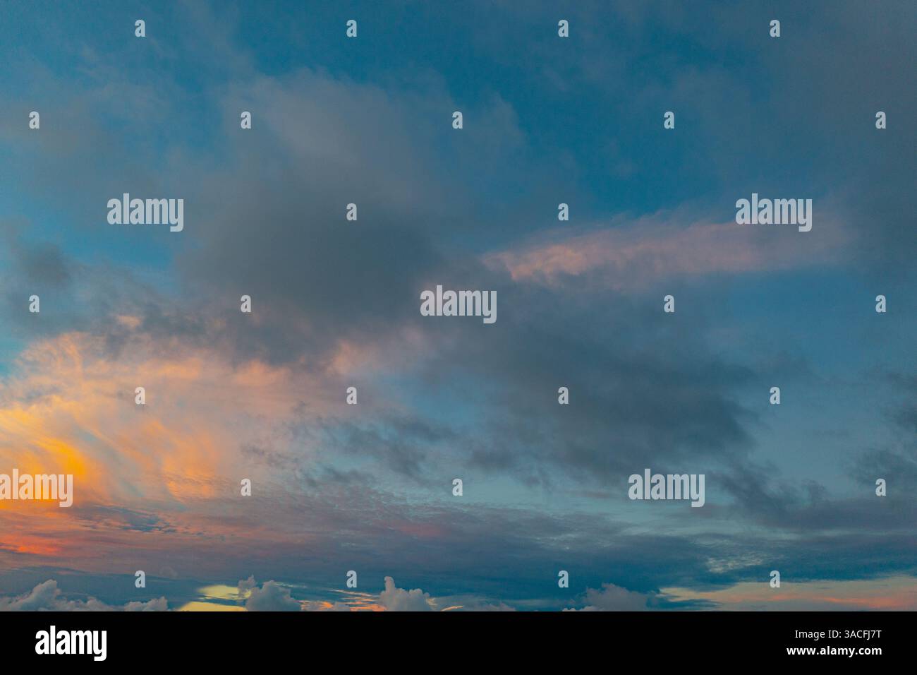 Aerial view clouds are moving slowly in the yellow sky at sunset. amazing cloud in yellow sky in ...