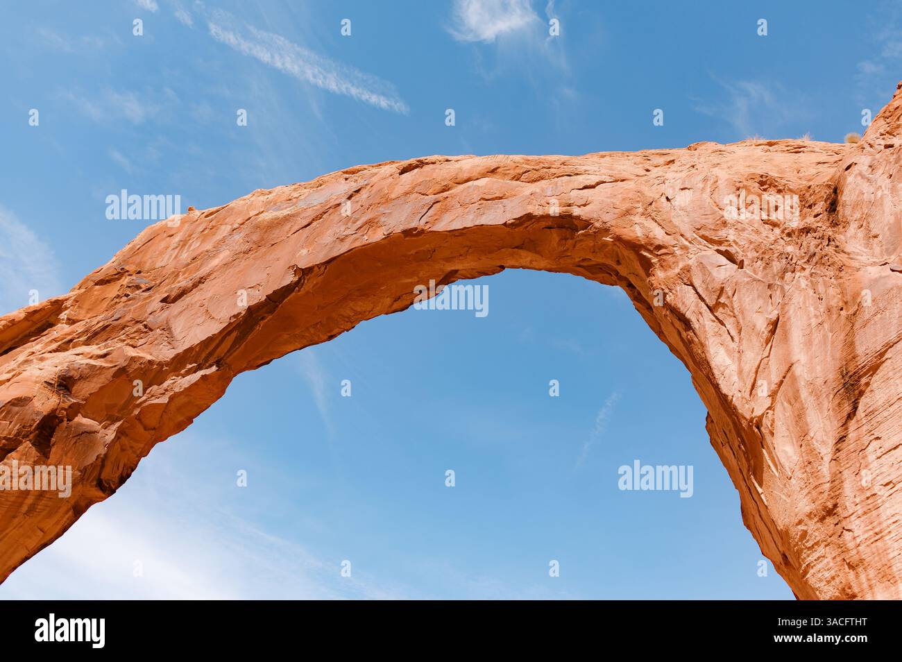 Expansive Moab Arch Stretching Across the Desert Sky Stock Photo - Alamy