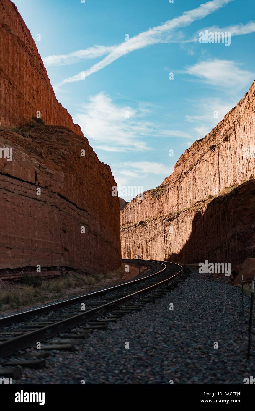 Railroad Tracks Winding Through a Towering Red Rock Canyon Stock Photo ...