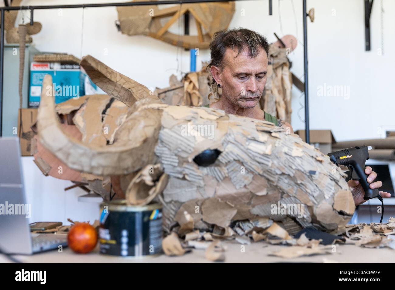 Puppetry designer Craig Leo working on puppets working on puppets for ...