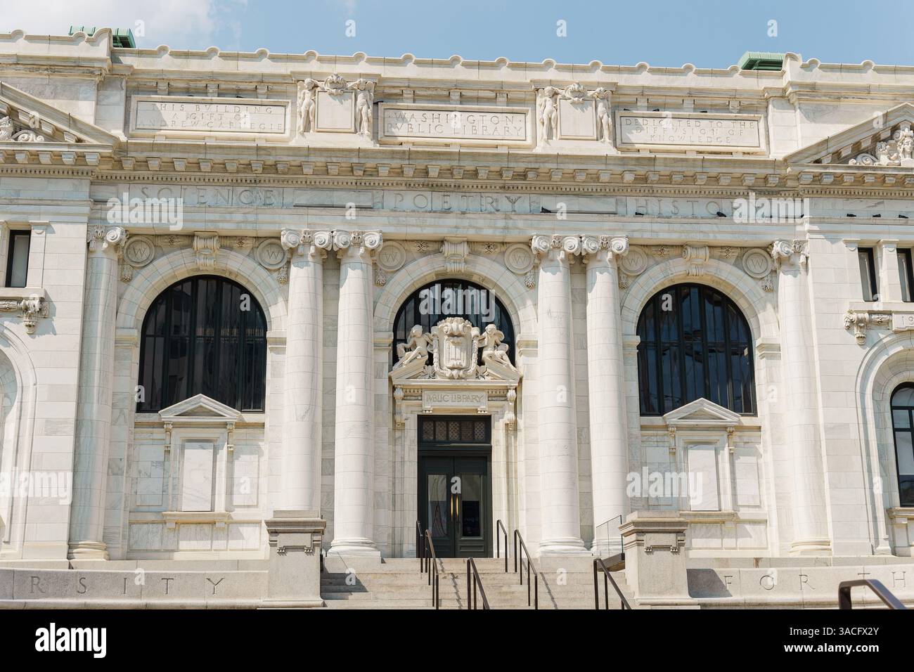 Historic neoclassical library facade with grand columns and carvings ...