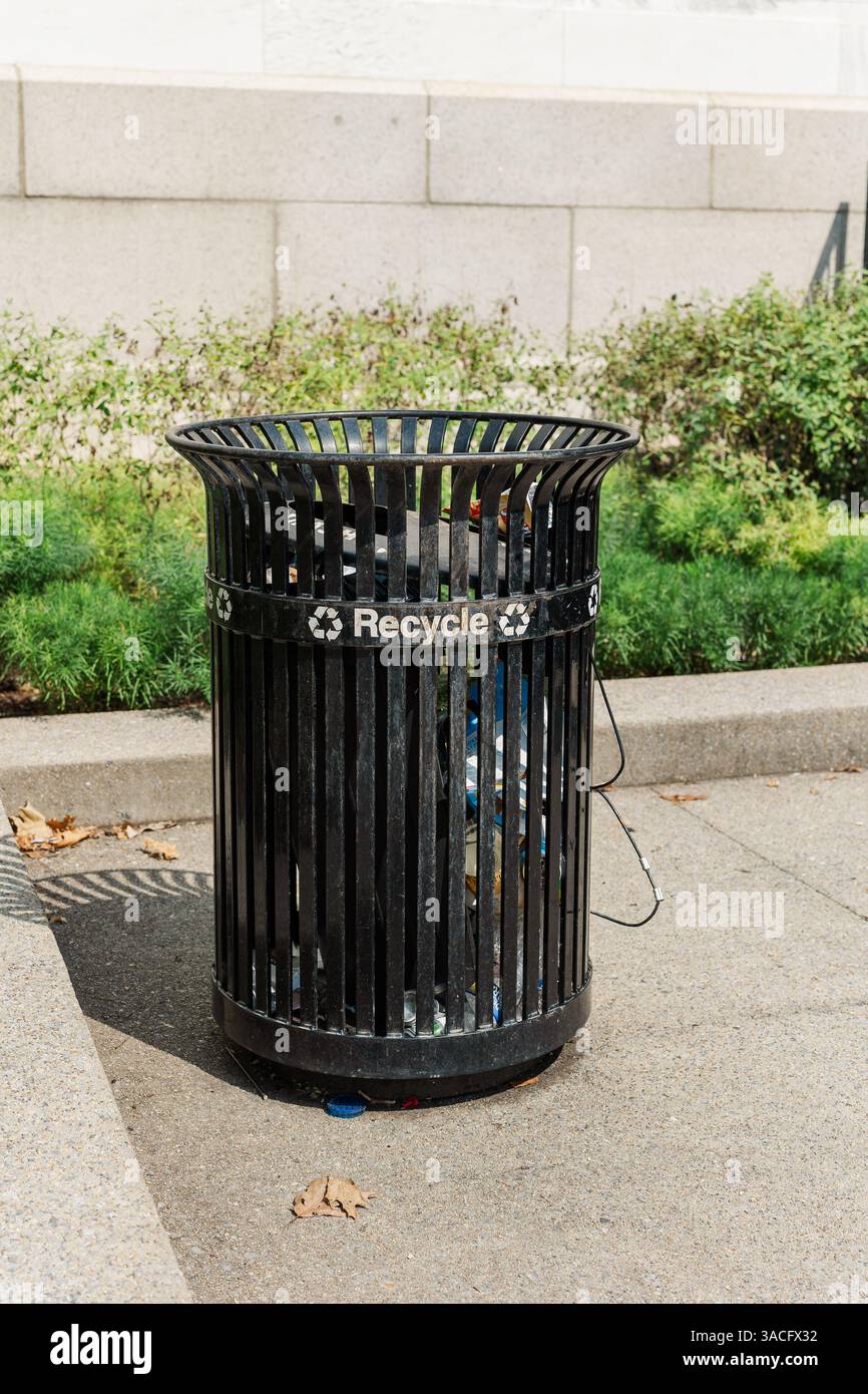Outdoor black recycling bin filled with bottles and cans Stock Photo ...