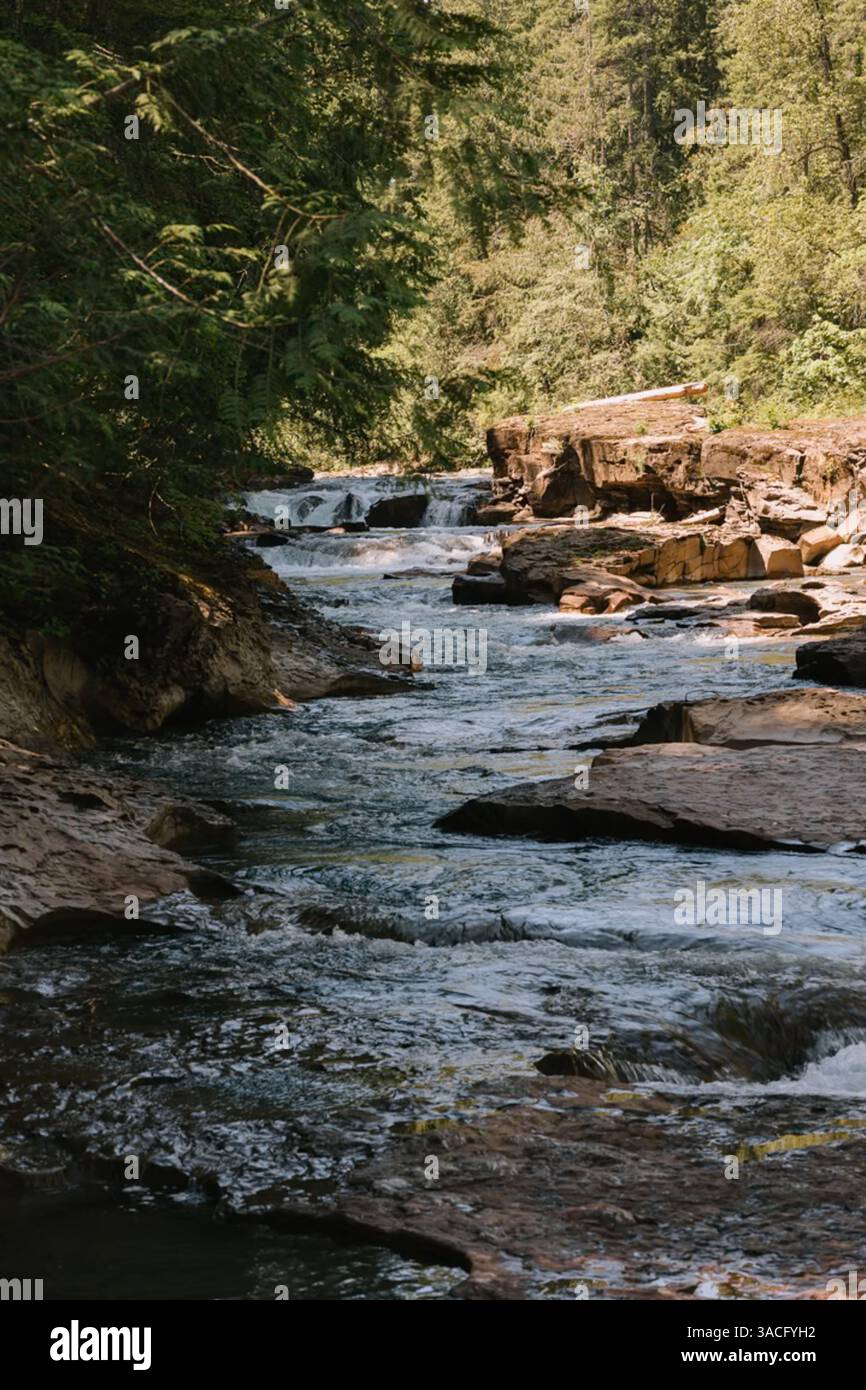 Serene river flows through rocky hi-res stock photography and images ...