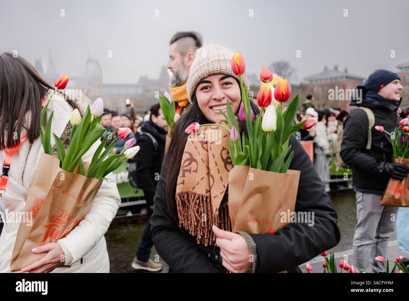 Happy Woman Holding Tulips During National Tulip Day in Amsterdam Stock ...