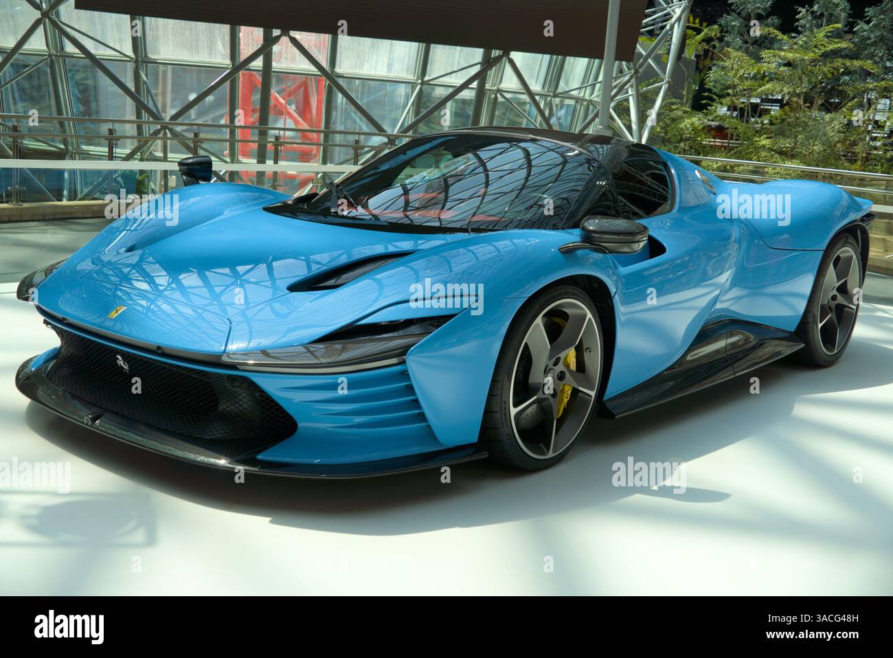 Light blue Ferrari Daytona SP3 spports car on display. Full shot ...