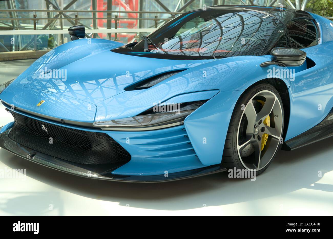 Light blue Ferrari Daytona SP3 spports car on display. Close up of the ...