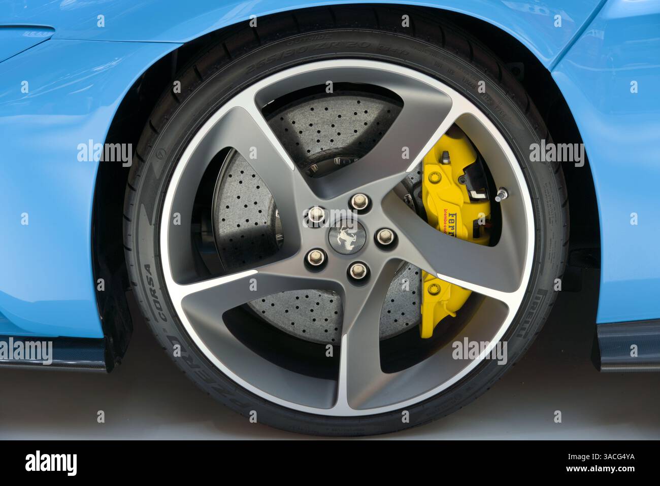 Light blue Ferrari Daytona SP3 spports car on display. Close up of ...