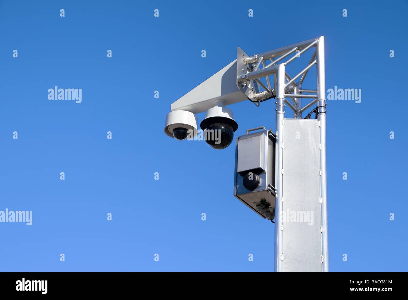 Surveillance cameras mounted on the pole with blue sky Stock Photo - Alamy