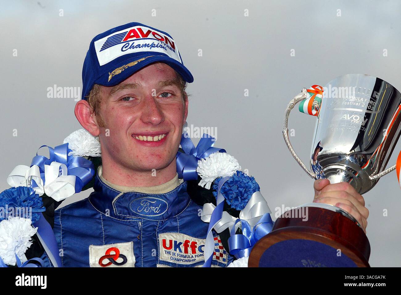 Race winner Joey Foster (GBR) celebrates victory with the trophy ...