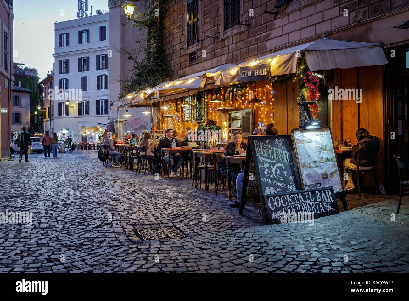 Rome, Italy - March 31, 2025: In the evening in Trastevere, a typical ...