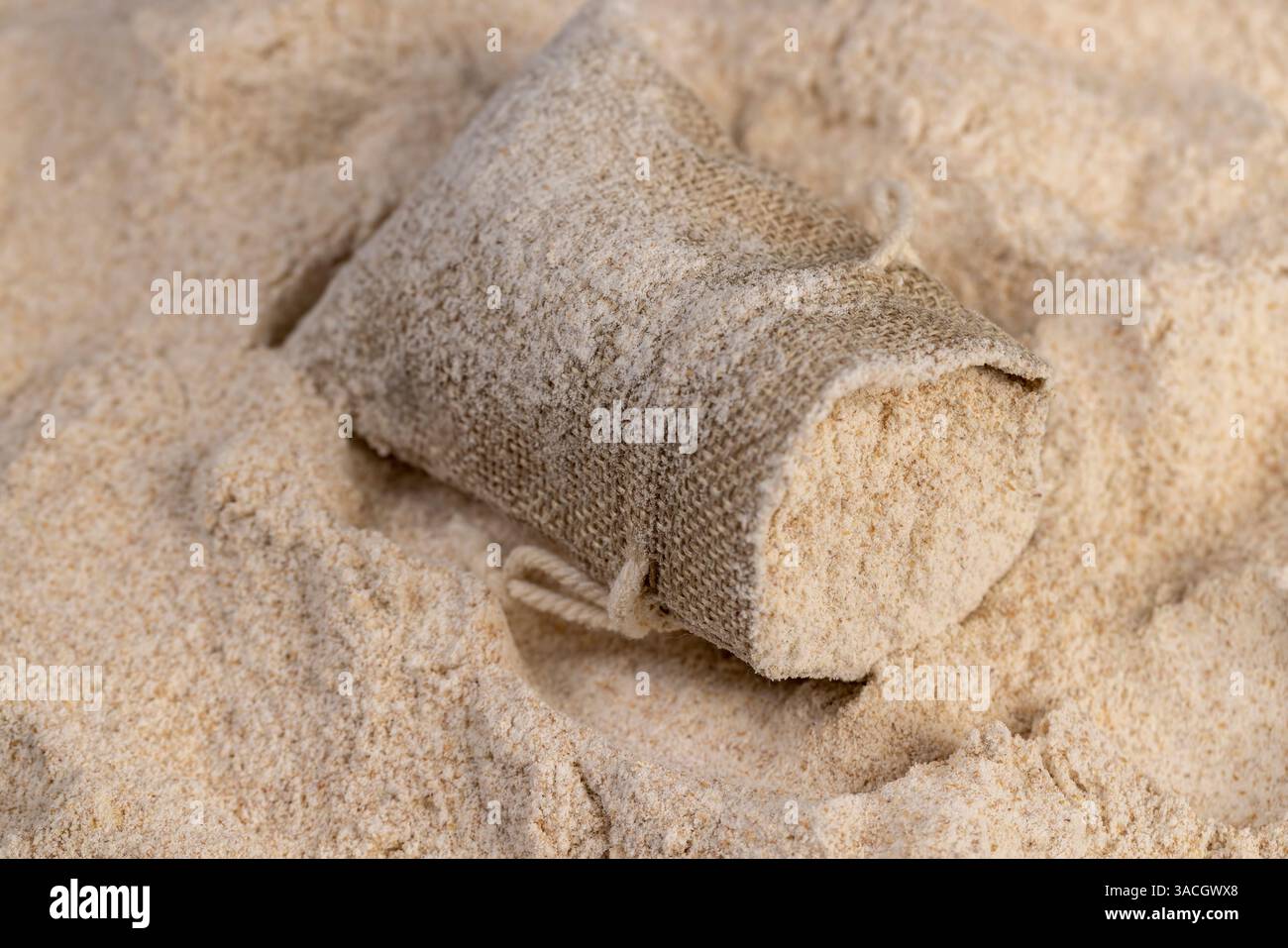wheat flour with bran in a bag, fresh wheat flour close-up, flour for ...