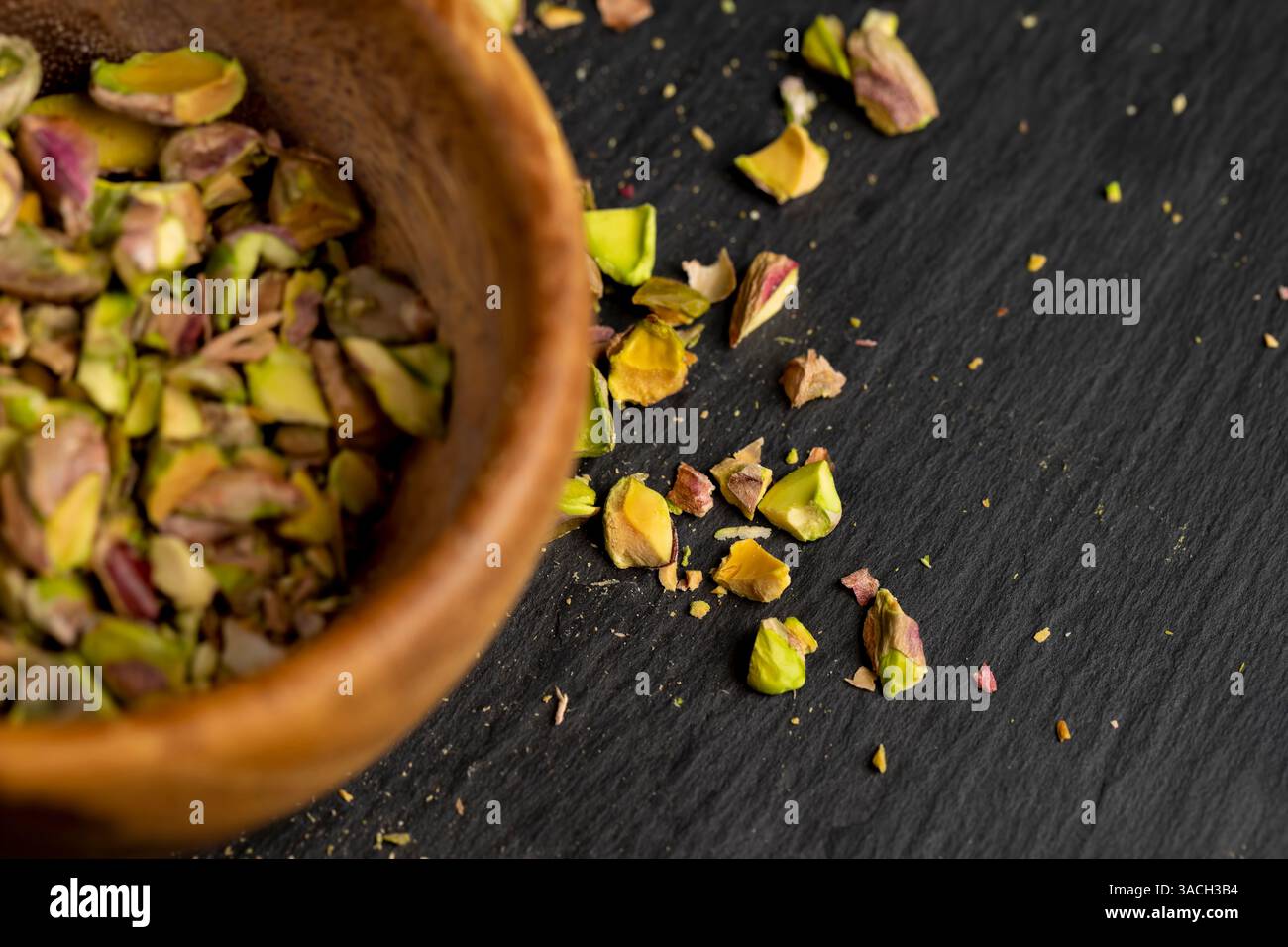 pistachios chopped and crushed into pieces of different sizes, a bunch ...