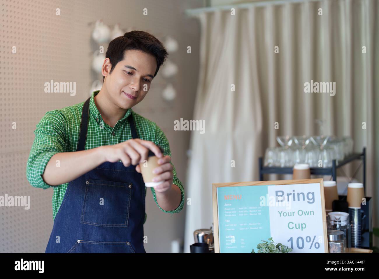 Sustainable Coffee Practices and Business Growth. A barista prepares a ...