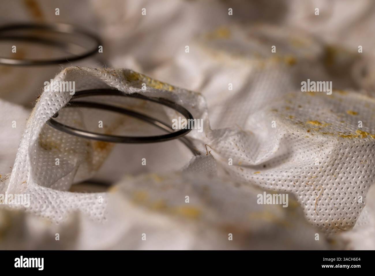 glued together old mattress springs in white fabric after long-term use ...