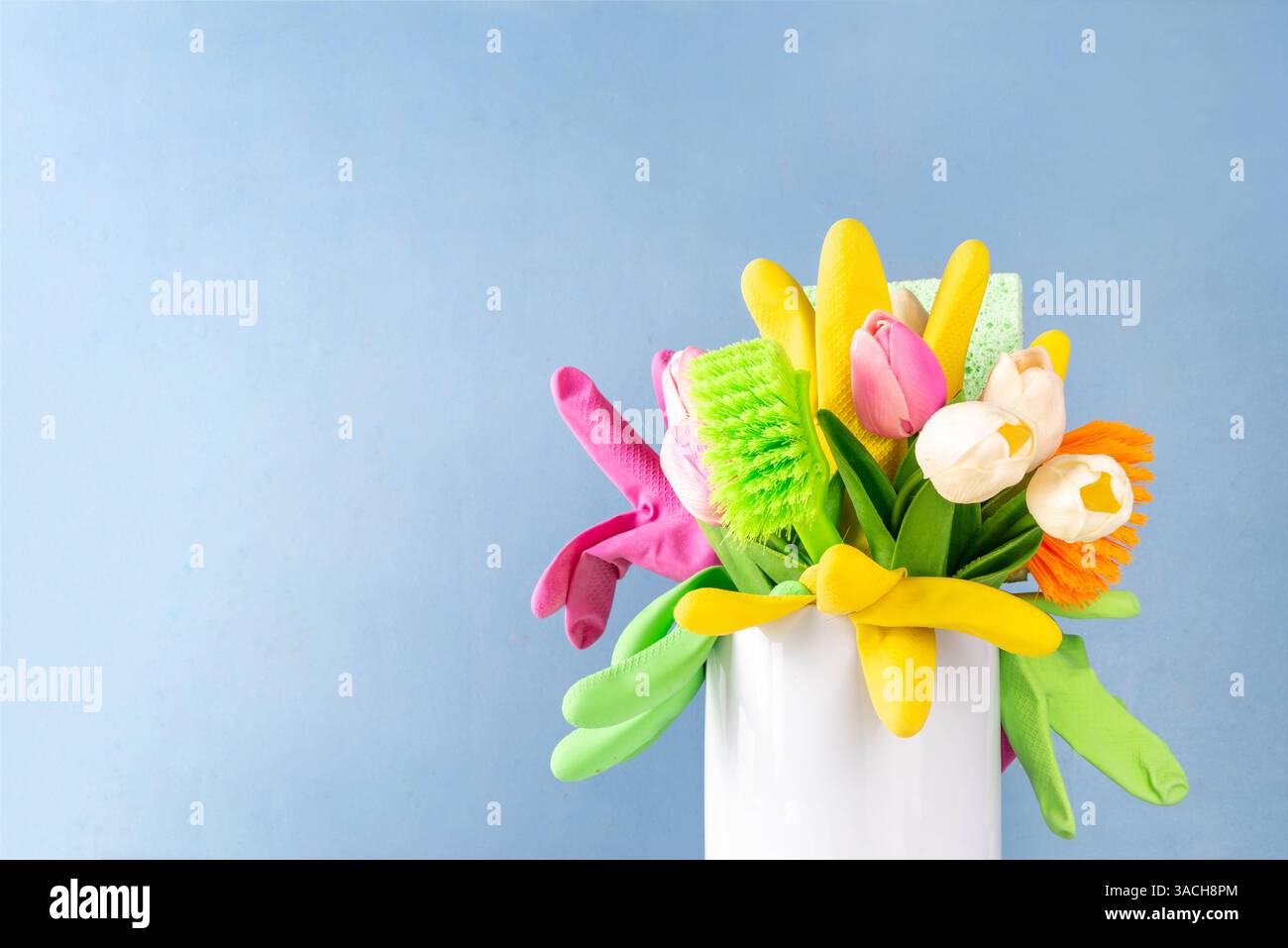 Colorful creative Spring cleaning background, with a bouquet with ...