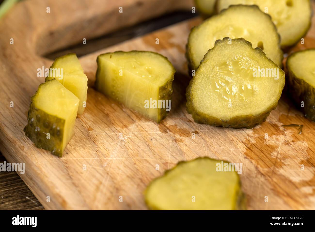 cut cucumbers marinated with salt and spices, pickled cucumbers during ...