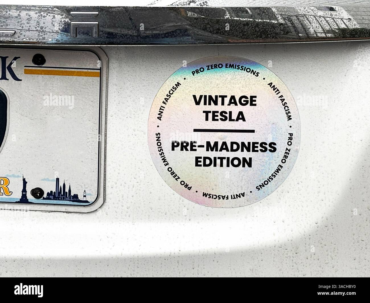 A bumper sticker on a Tesla car bought before Elon Musk went from ...