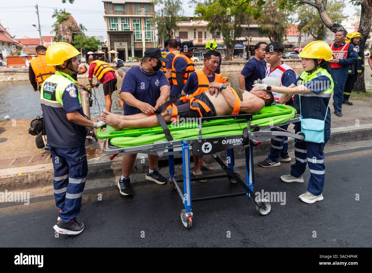 Disaster prevention and mitigation officers are seen practicing water ...