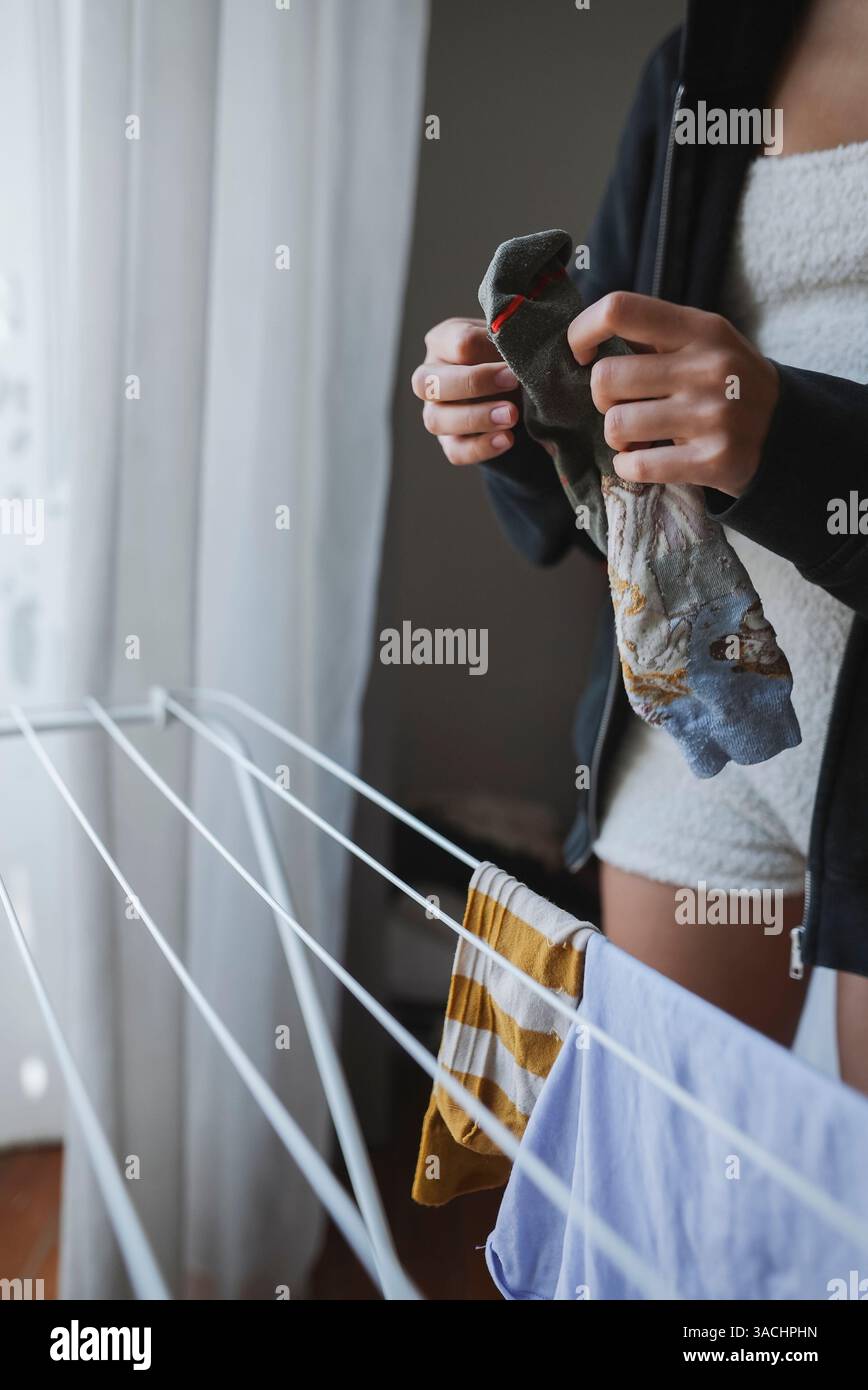 An Indoor Laundry Routine Featuring Freshly Washed Clothes in a Bright ...