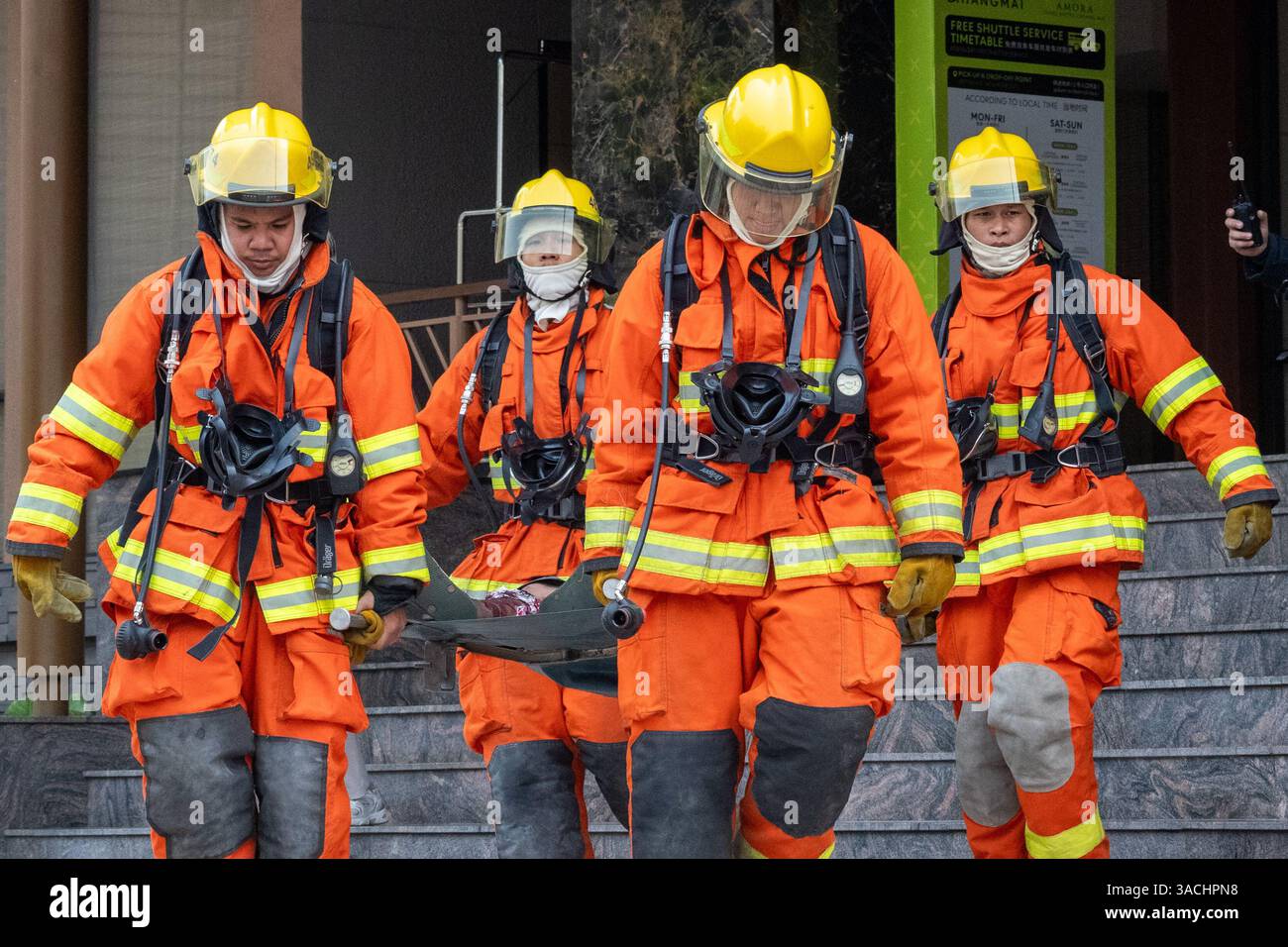 One of the drill participants is carried by disaster prevention and ...