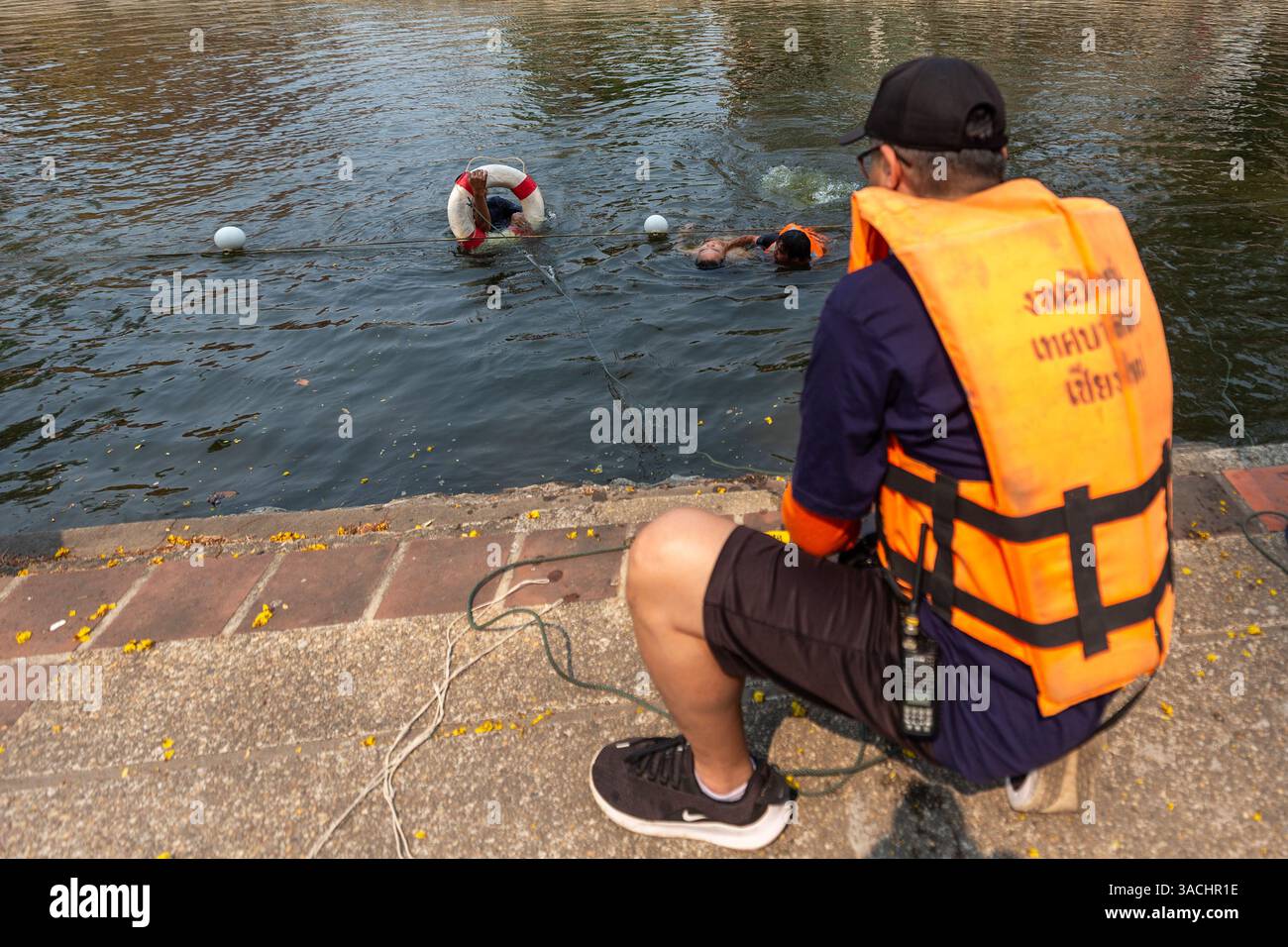 Disaster prevention and mitigation officers are seen practicing water ...