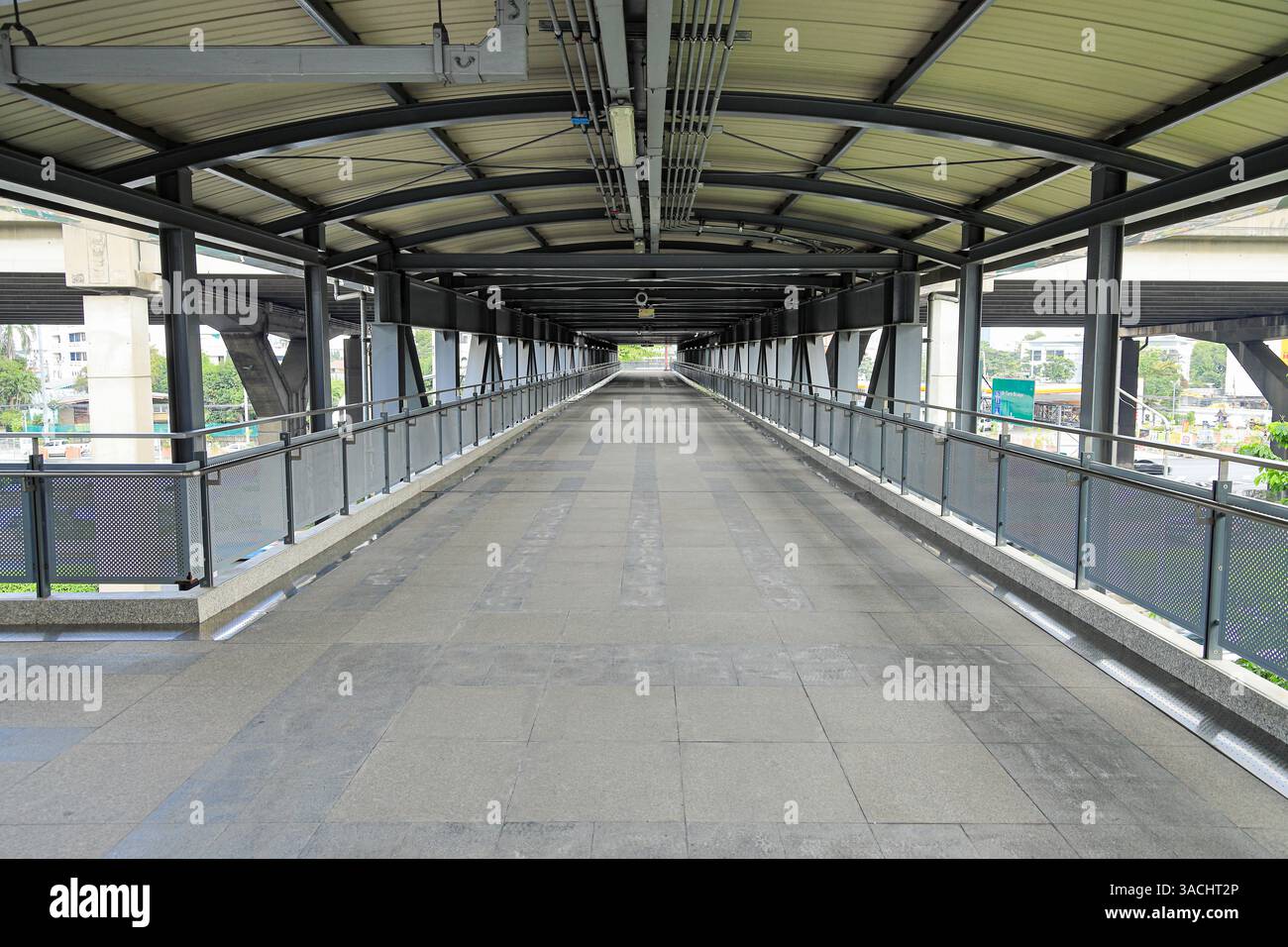 Pedestrian pathway or corridor or hallway between train station and ...