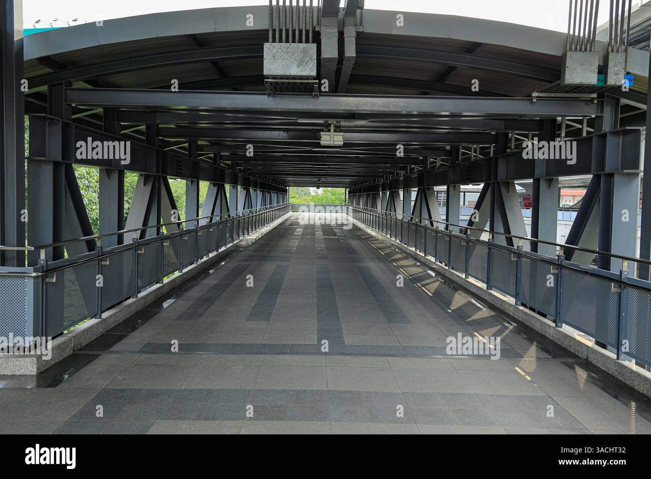 Pedestrian pathway or corridor or hallway between train station and ...
