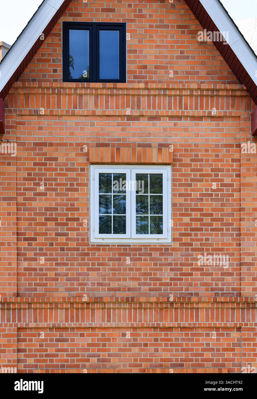 Building made of brick facade with beautiful white wooden windows Stock ...