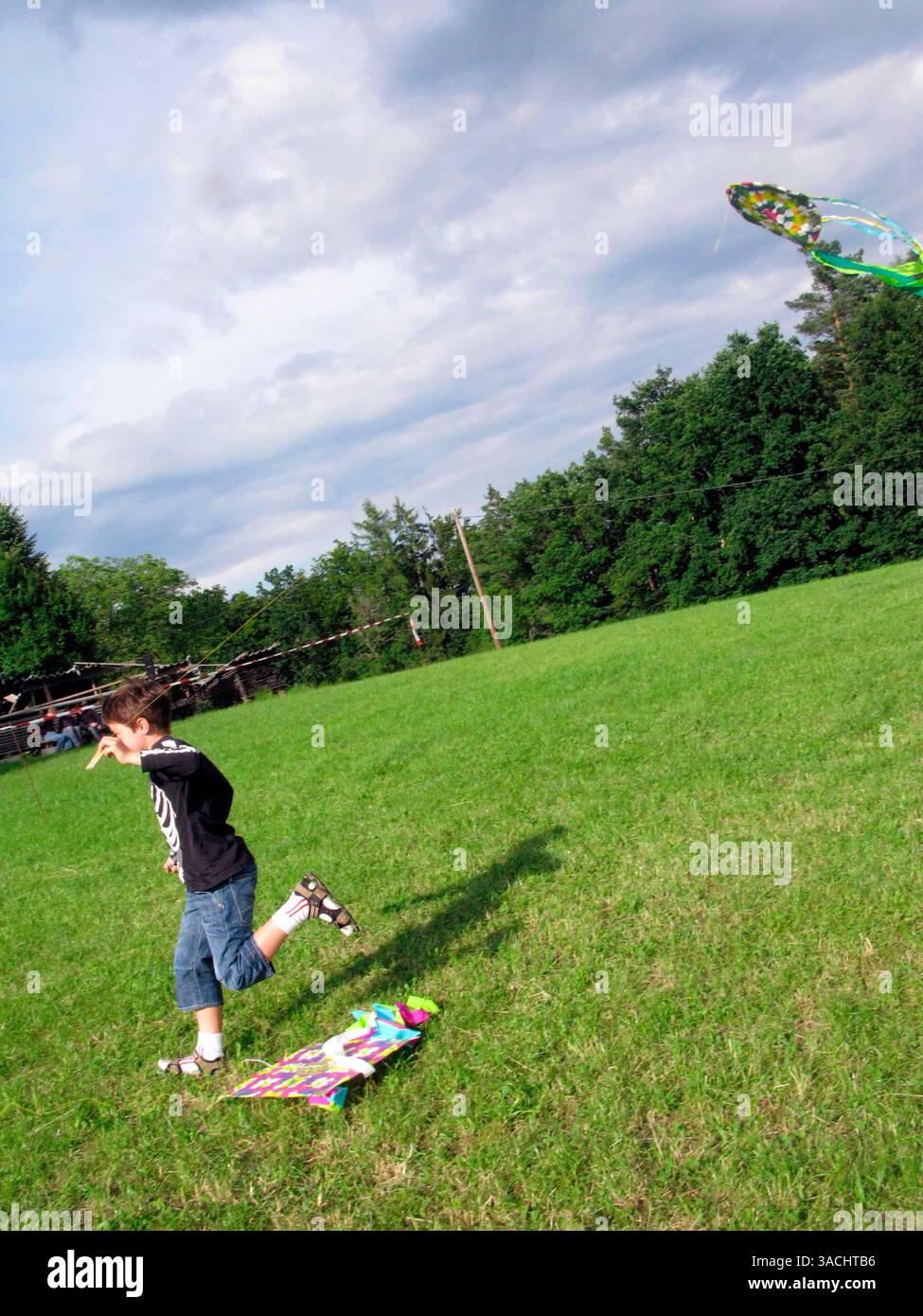 kite flying as a summer leisure activity in windy weather conditions ...