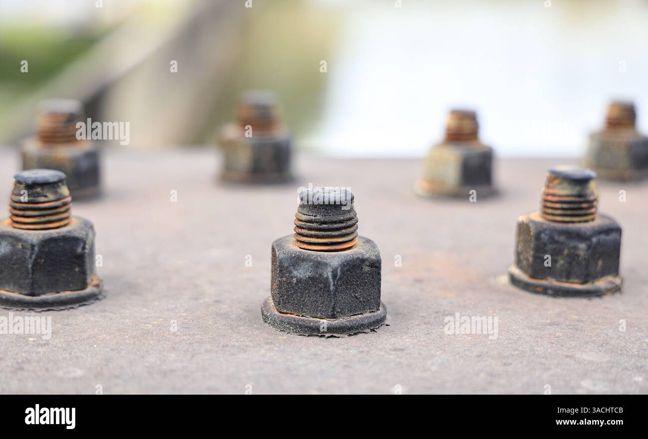 Metal supports Bolts, nuts, threaded on beams of the Steel Construction ...