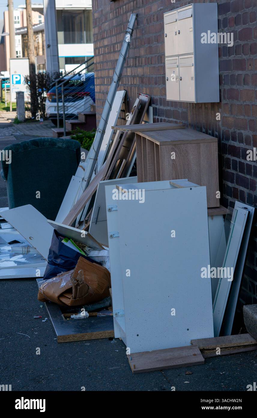 Bulky waste for recycling on a city sidewalk vertical Stock Photo - Alamy