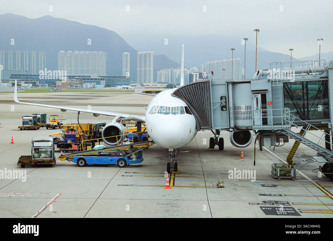 Airport baggage tug (baggage dolly transport) on duty and Ground ...