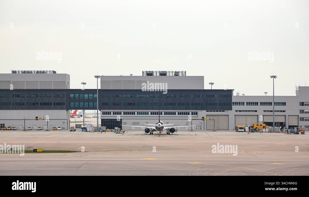 Airplane parking at parking bay. Service passengers by bus from bus ...