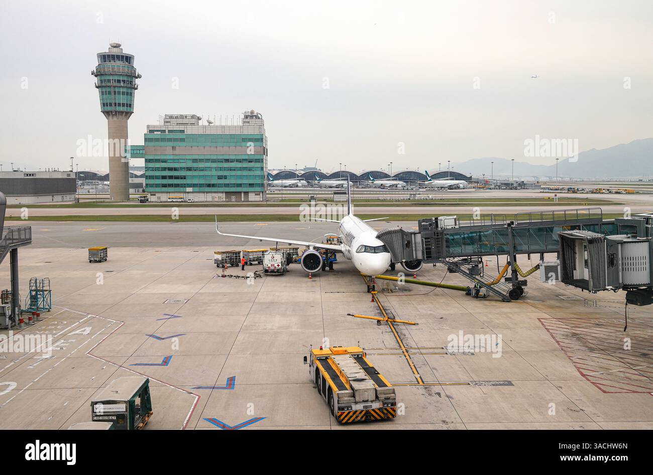 Airport baggage tug (baggage dolly transport) on duty and Ground ...