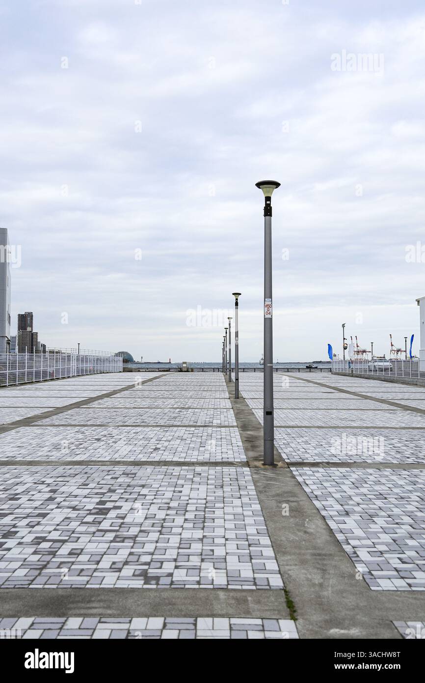 Electric poles line in seaside park, Japan Stock Photo - Alamy