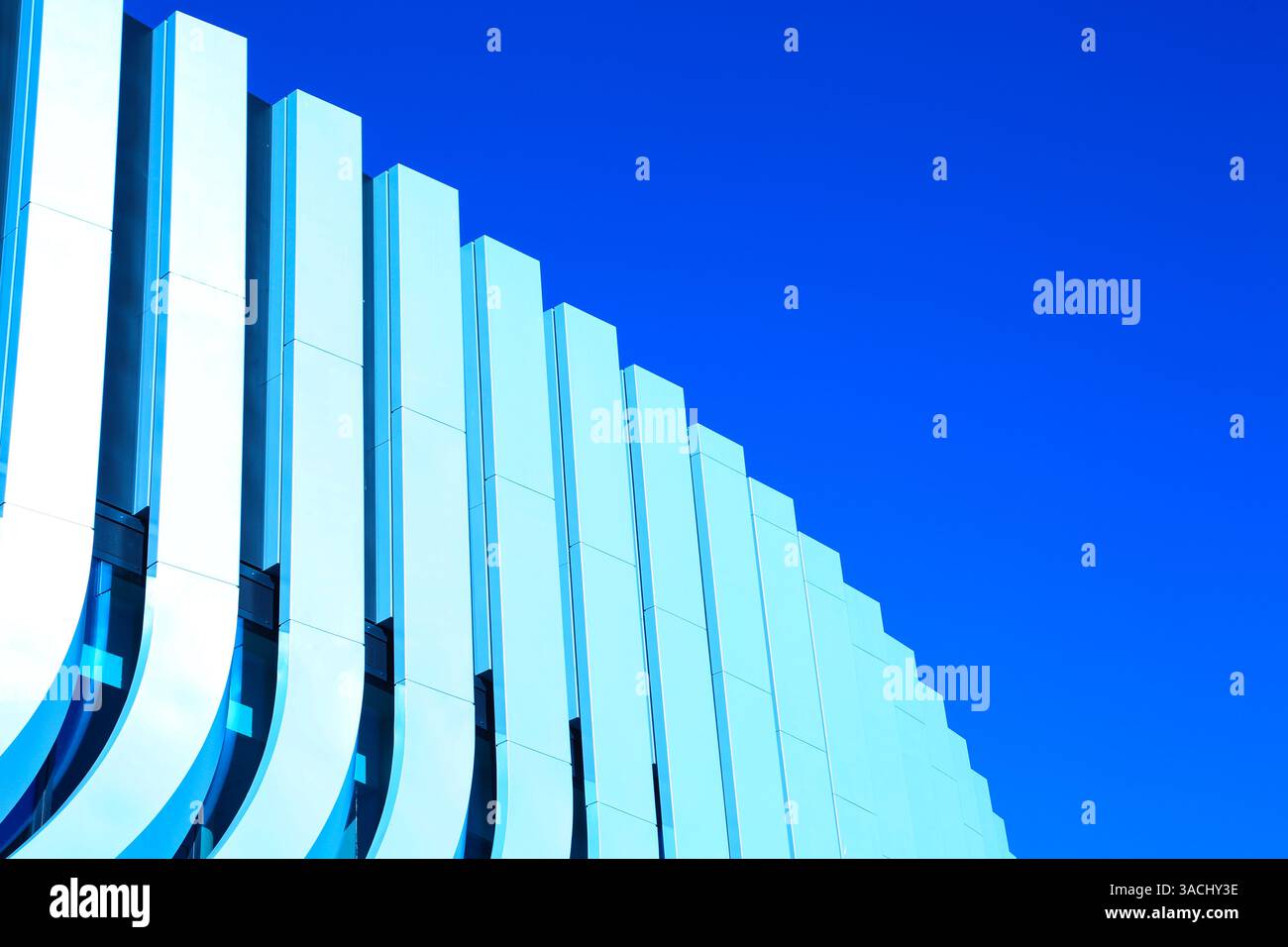 white facade with blue sky, sports hall Stock Photo - Alamy