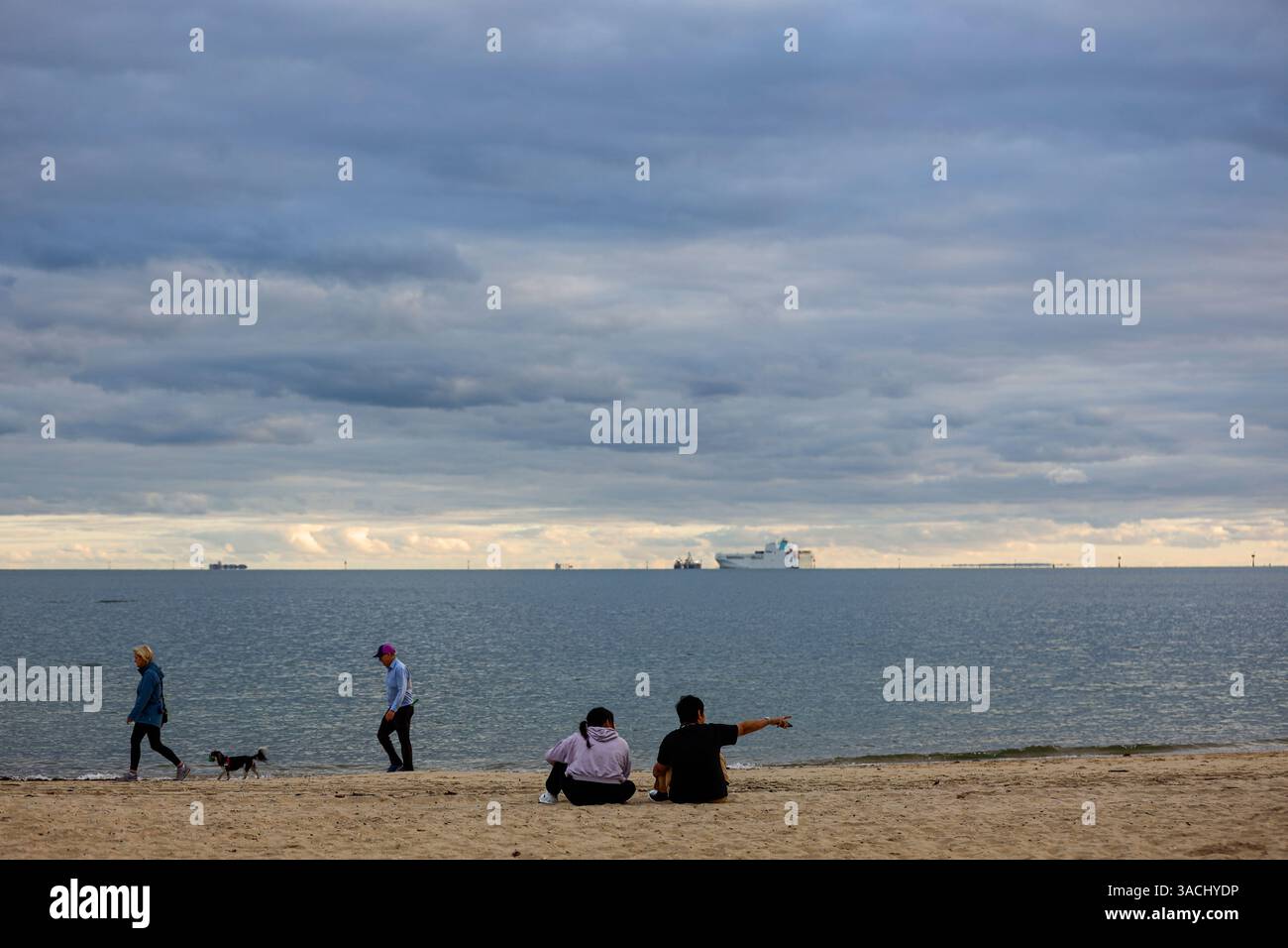 Beachgoers sit relax on hi-res stock photography and images - Alamy