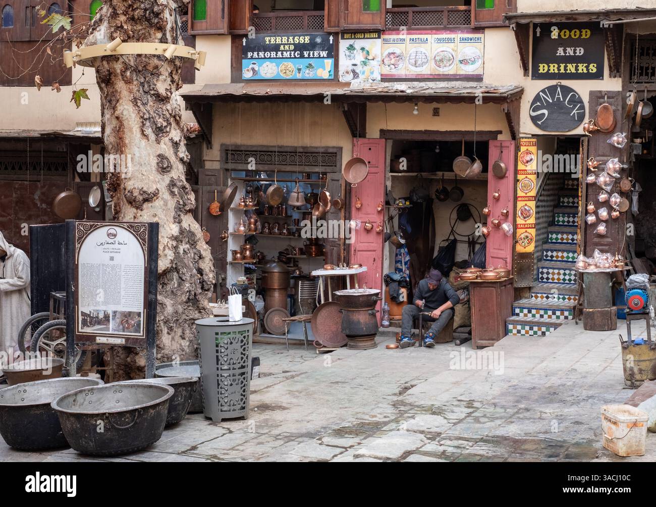 Craftsman blacksmith works in workshop in restored restored Place ...