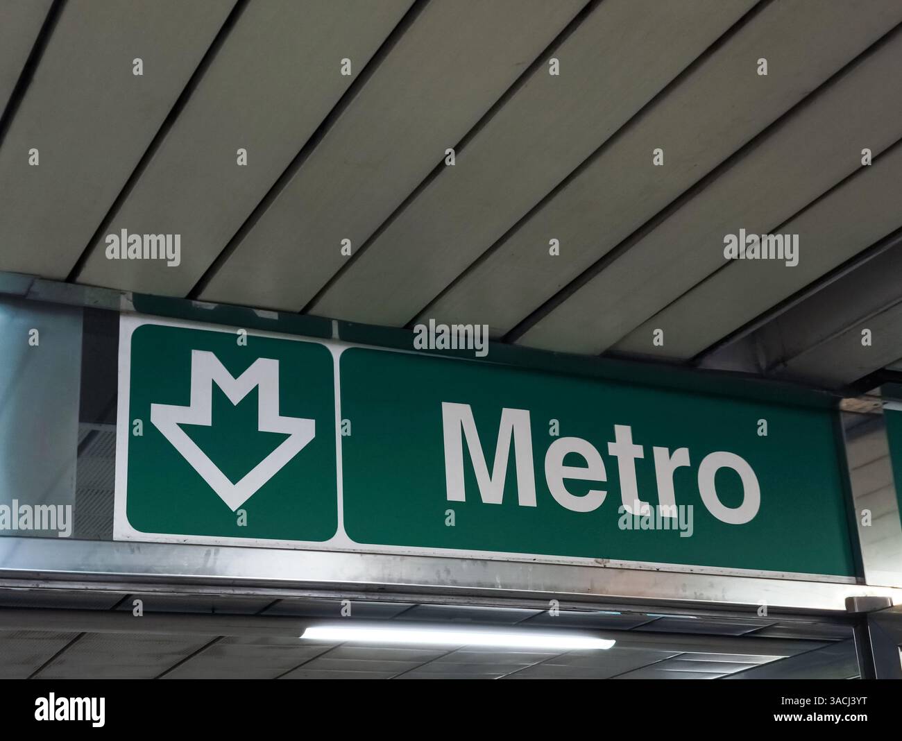 Prague, Czech Republic - March 25, 2025: Green metro sign with a white ...