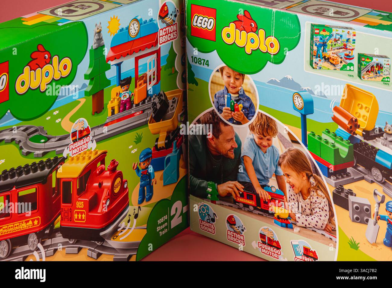 Two vibrant toy train sets are displayed, featuring trains, tracks, and ...