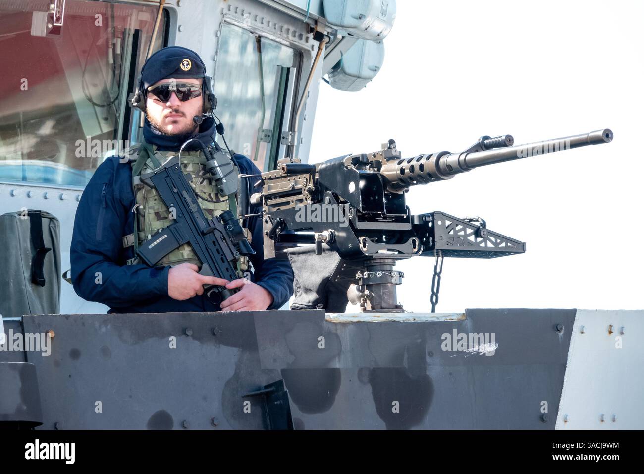 Hamburg, Germany. 04th Apr, 2025. A Royal Navy sailor stands next to a ...