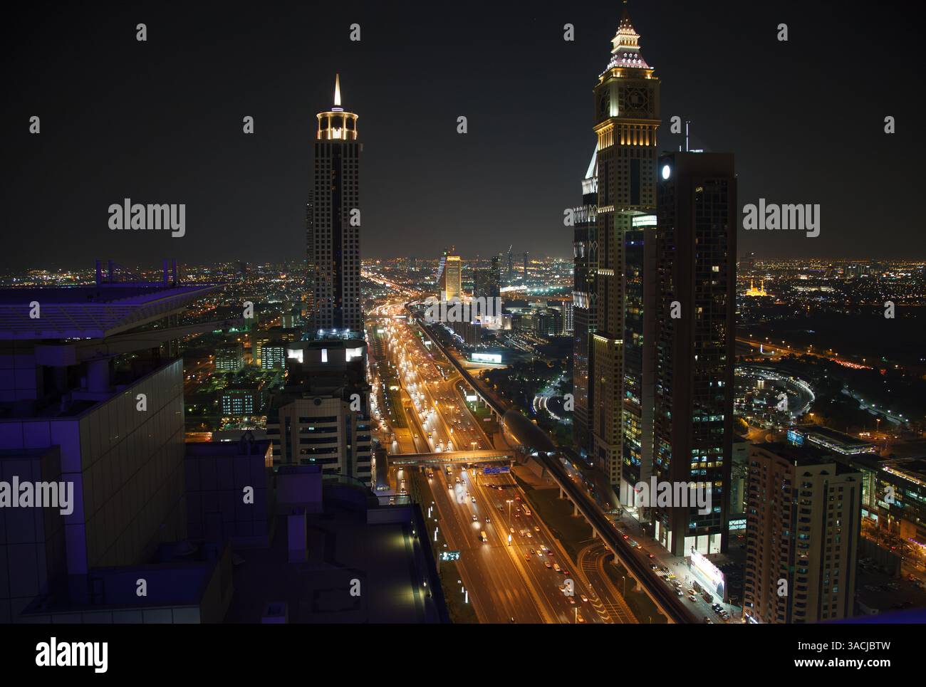 The Al Yaqoub Tower and the modern buildings of Dubai at night United ...