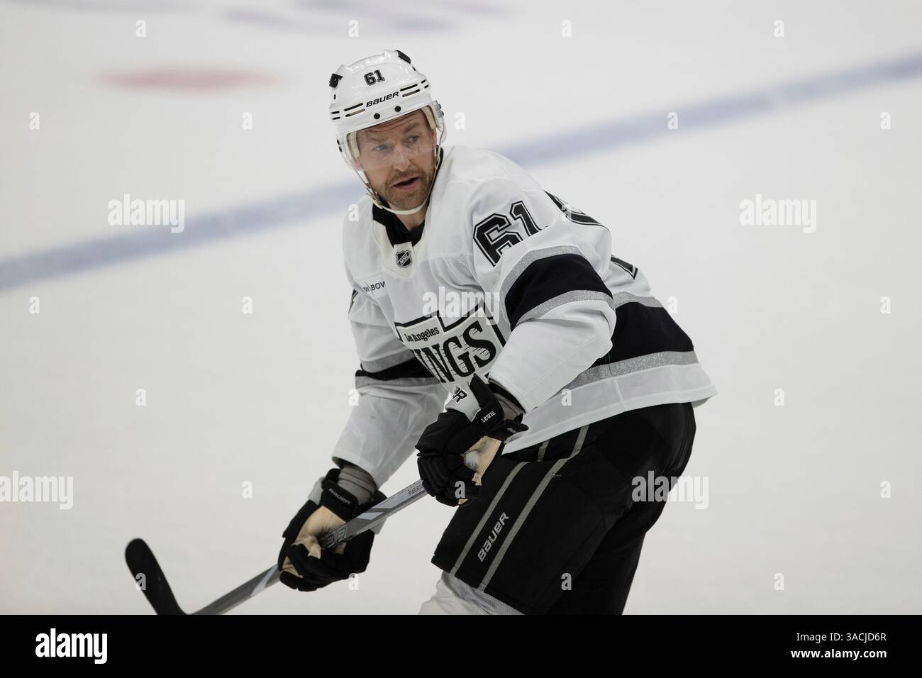 Los Angeles Kings center Trevor Lewis (61) skates up the ice against ...