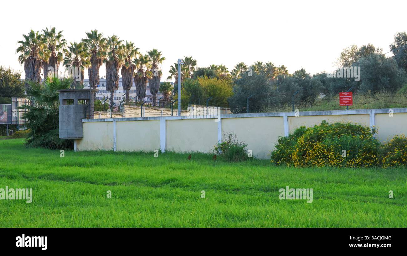 Concrete guard tower and perimeter wall securing the army transport ...