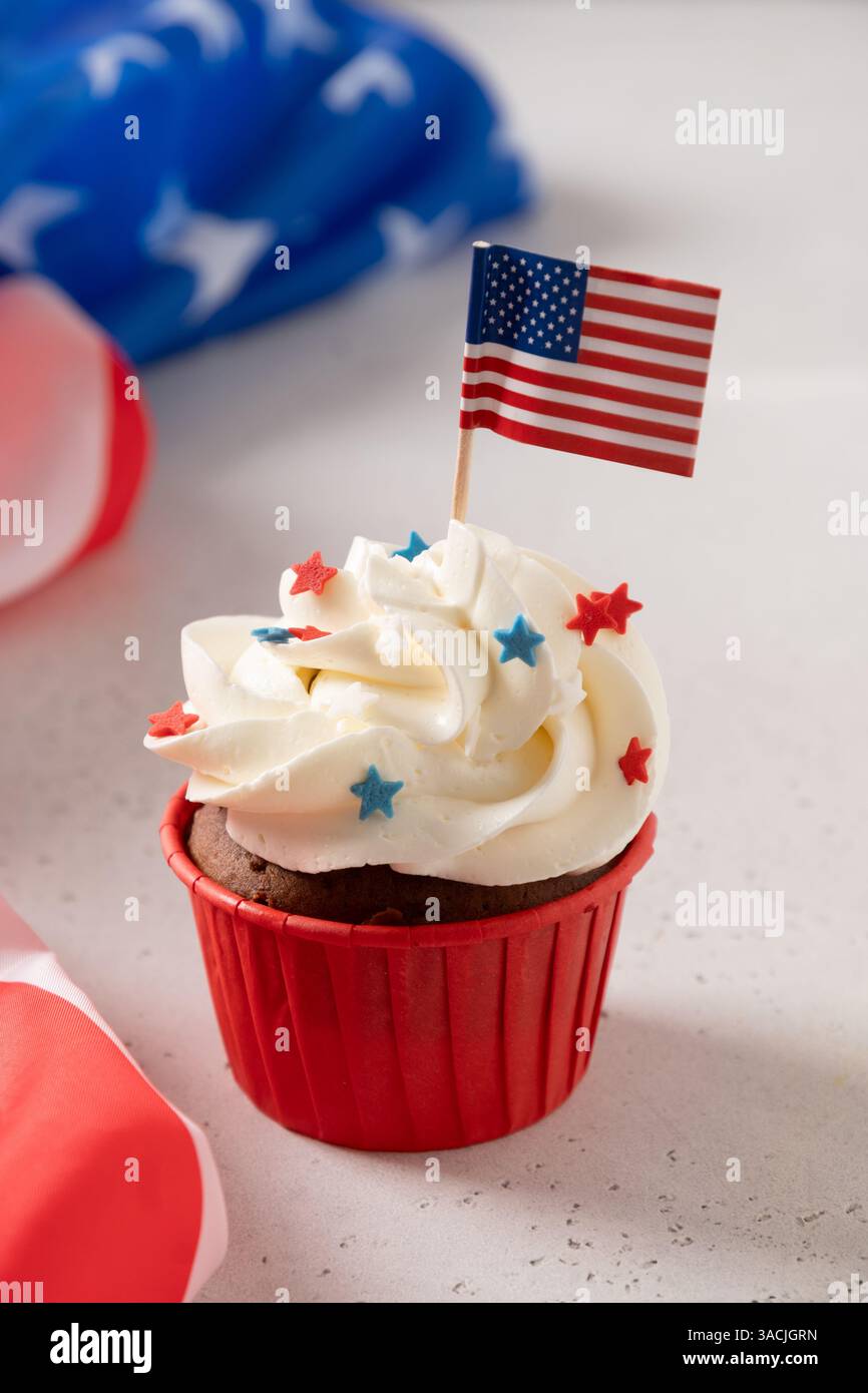 Traditional American sweet cupcake with sugar sprinkles in color USA ...
