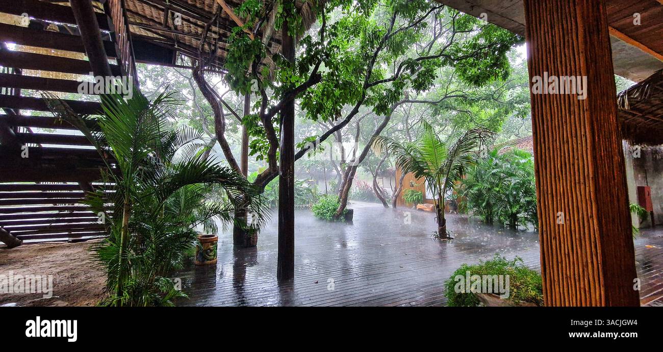 Heavy rain in a bar at Lagoa do Paraiso beach in Jericoacoara Brazil ...