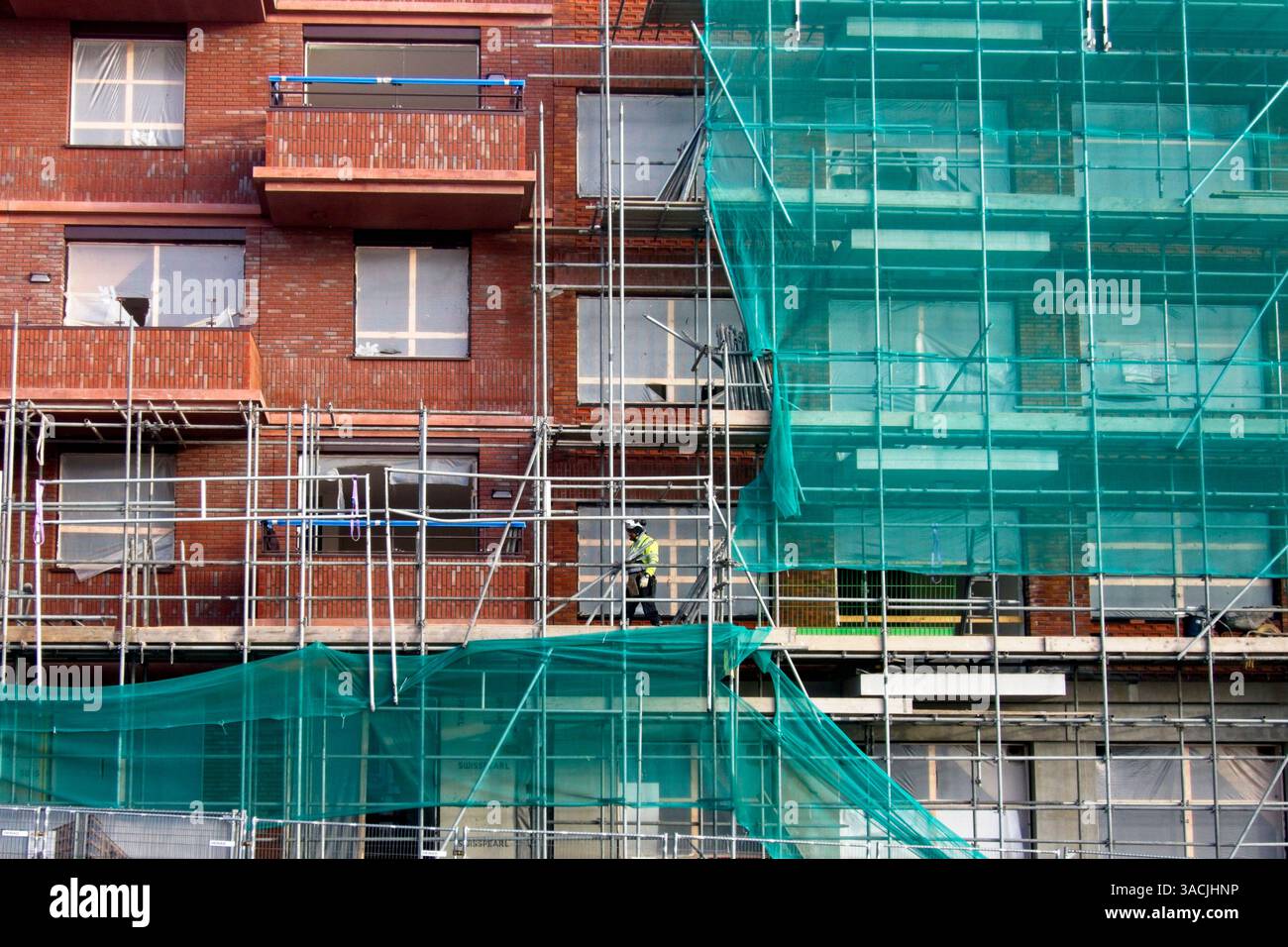 Amsterdam Netherlands - 27 March 2025 - Worker on scaffold on ...